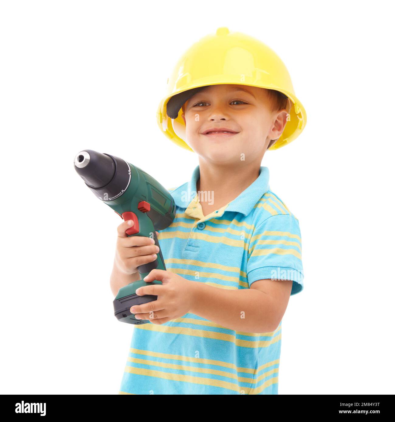 Playing with Dads toys. Studio shot of a cute young boy pretending to ...