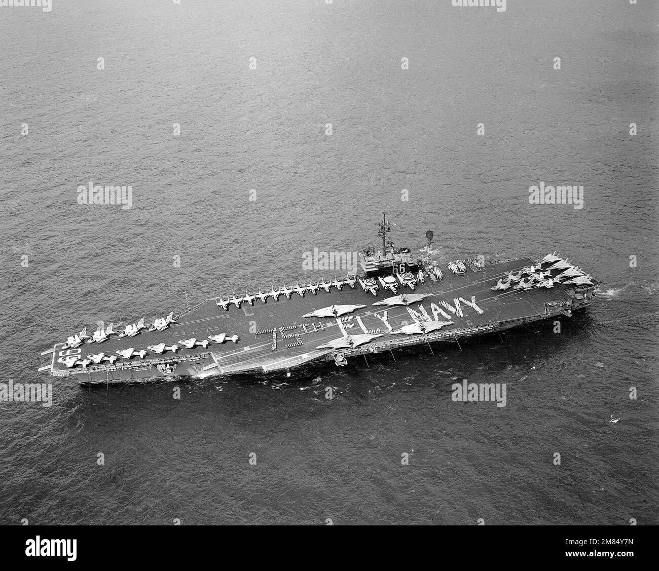 Crewmen and members of Carrier Air Wing One form a "75th Fly Navy ...