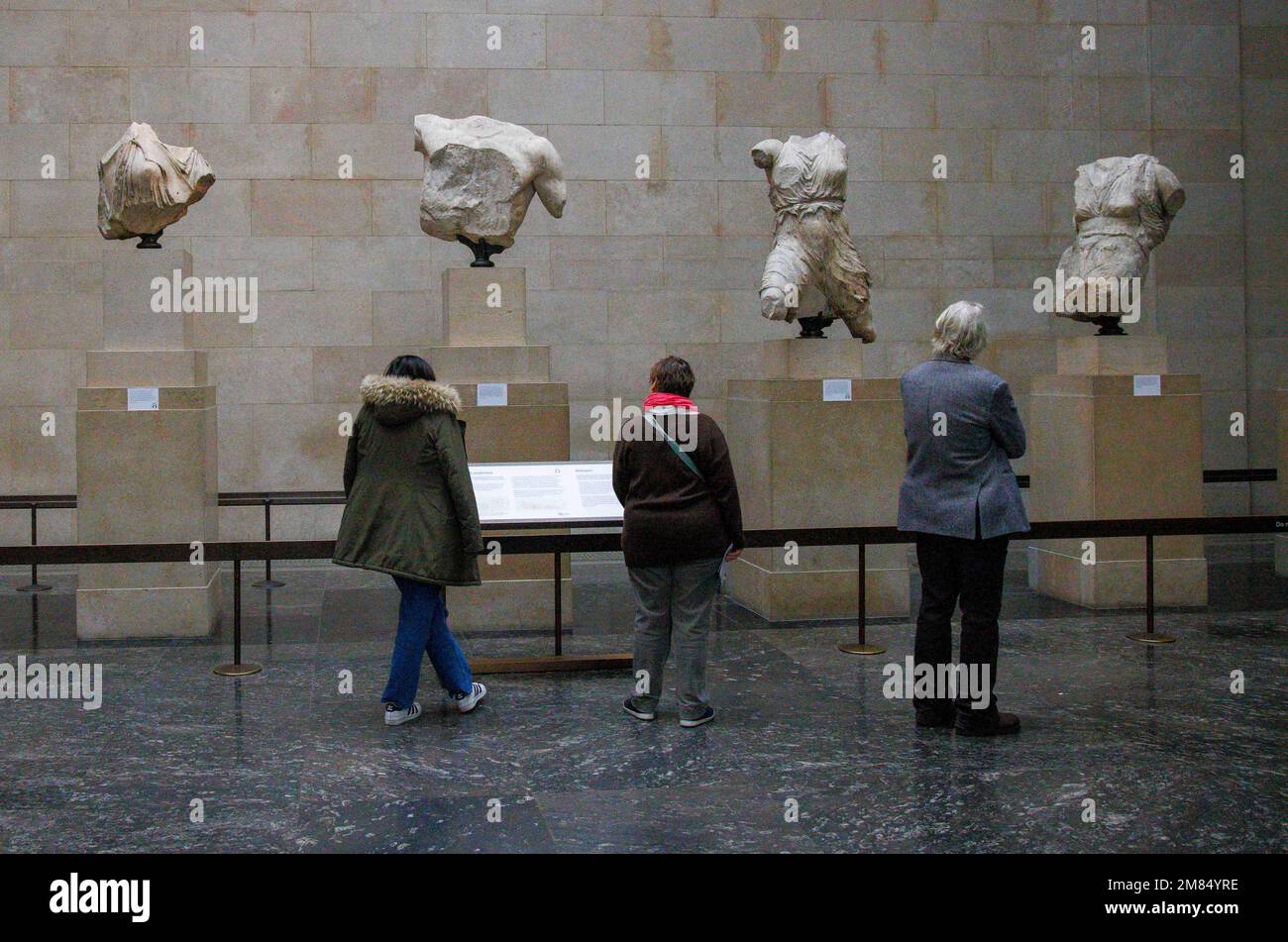 London, UK 12 Jan 2023 Visitors looking at exhibits from the Parthenon in the Parthenon ...