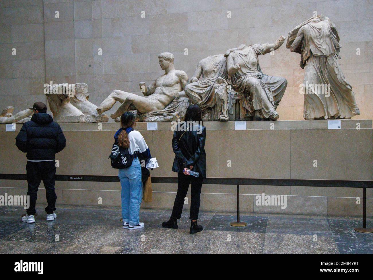 London, UK 12 Jan 2023 Visitors looking at exhibits from the Parthenon in the Parthenon ...