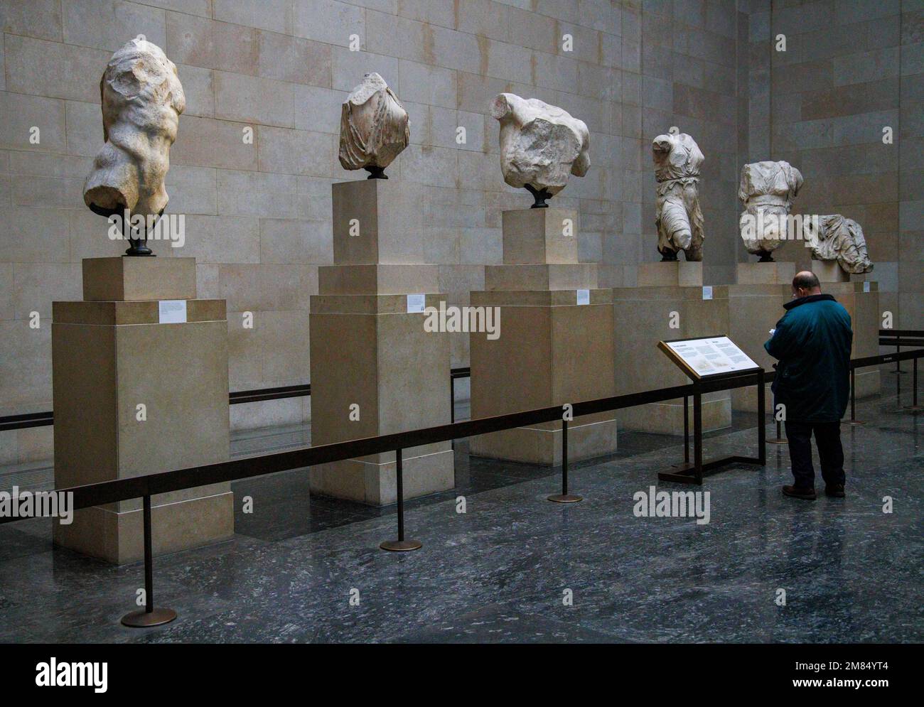London, UK 12 Jan 2023 Visitors looking at exhibits from the Parthenon in the Parthenon ...