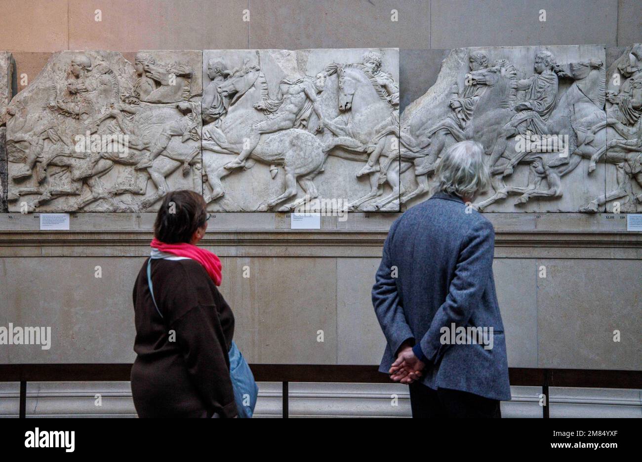 London, UK 12 Jan 2023 Visitors looking at exhibits from the Parthenon in the Parthenon ...