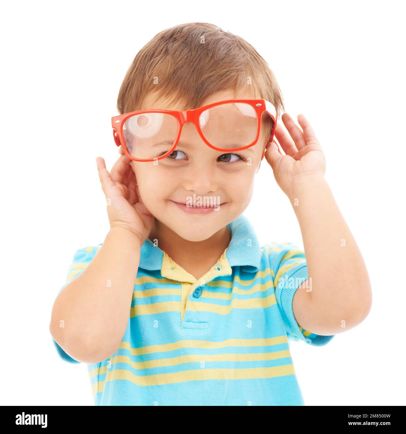 Im just a bit shy. Studio shot of a shy young boy wearing glasses ...