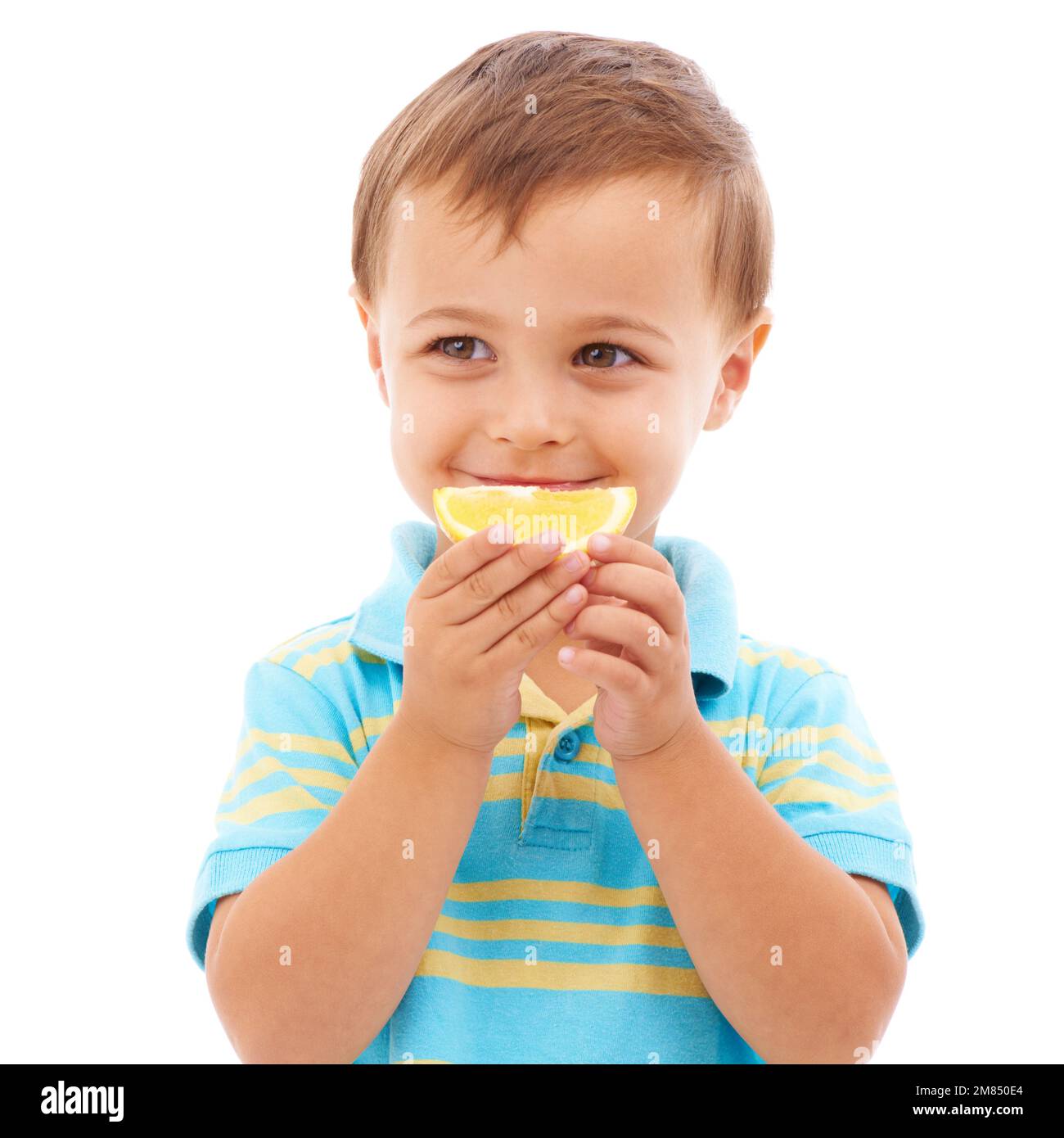 Instilling good eating habits. Studio shot of a young boy eating an ...