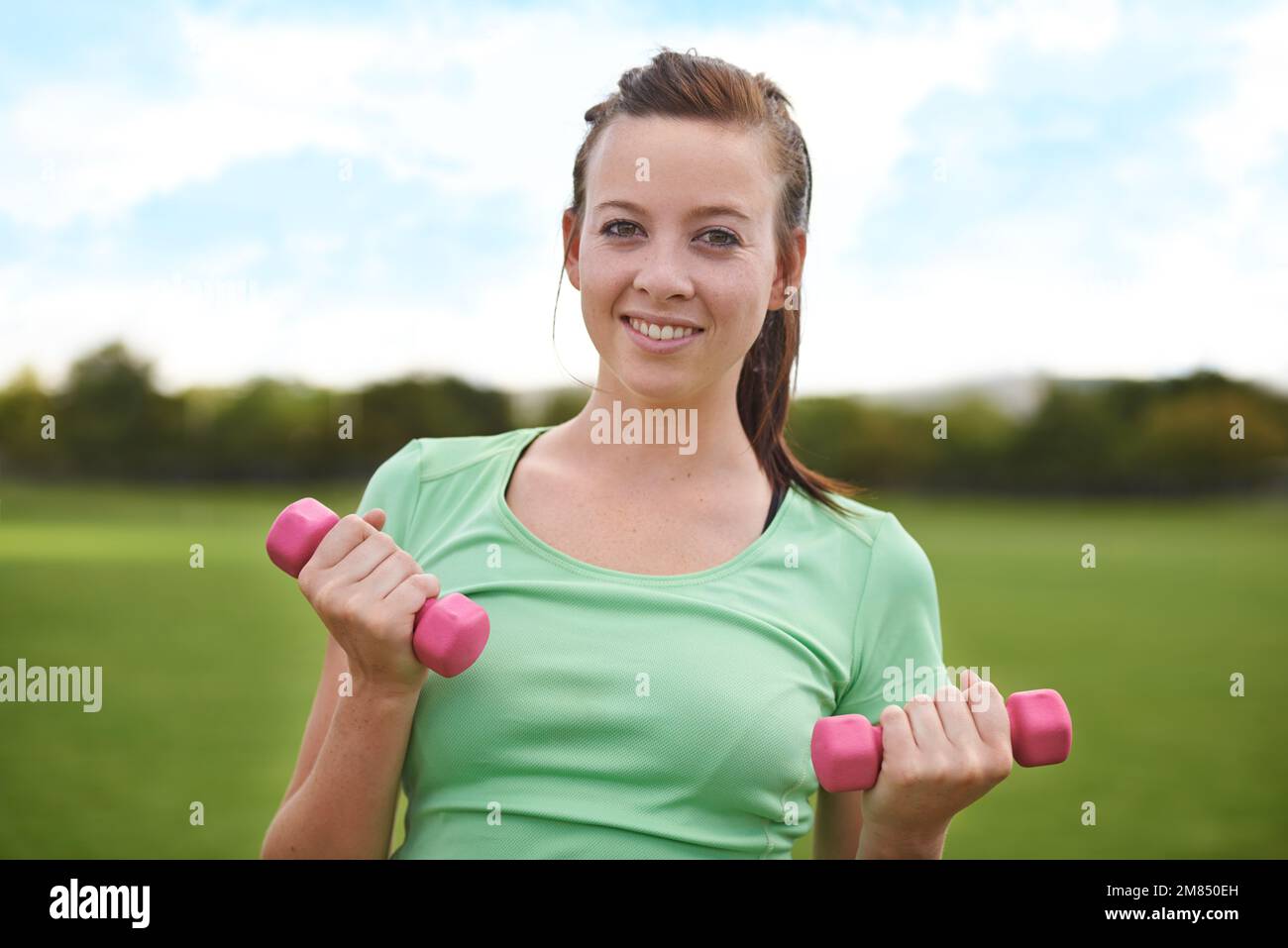 Sunshine and exercise. a group of young women exercising outdoors Stock ...