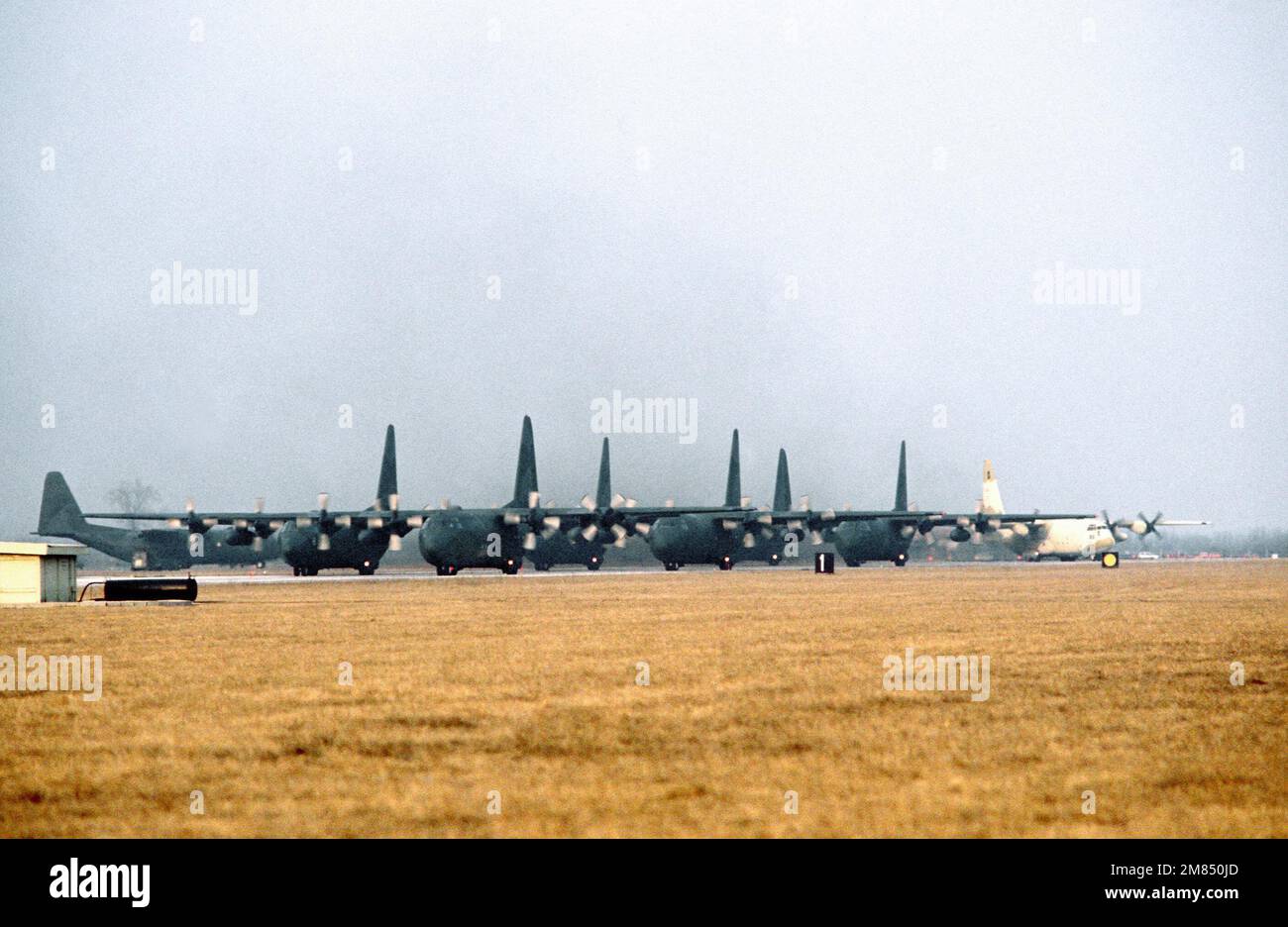 C-130E Hercules aircraft of the 37th Tactical Airlift Squadron taxi on ...