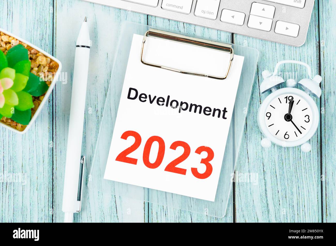 Development 2023 text on clipboard with pen and keyboard computer on ...