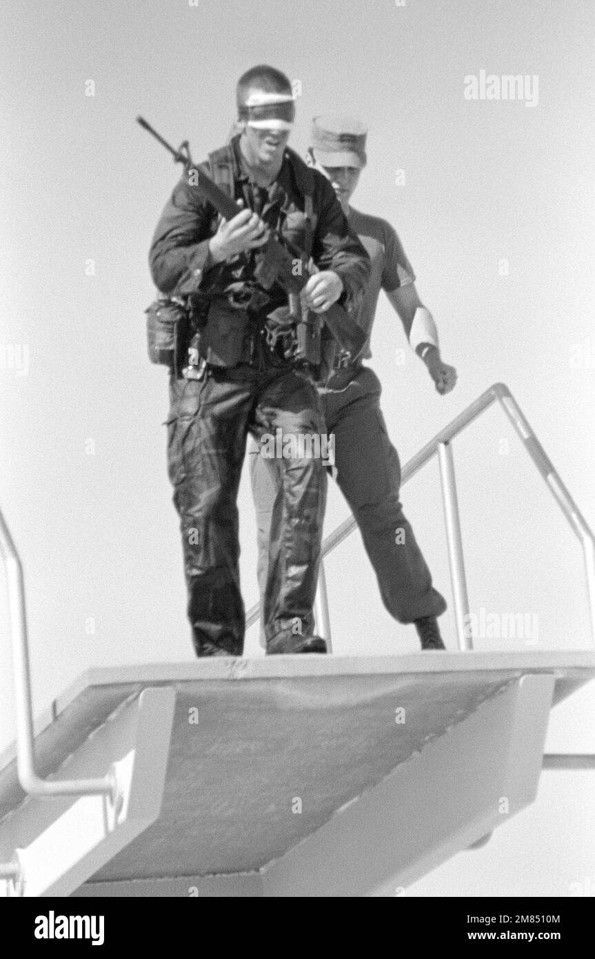 Sergeant Tim Hoye, instructor, prepares to push blindfolded SENIOR ...
