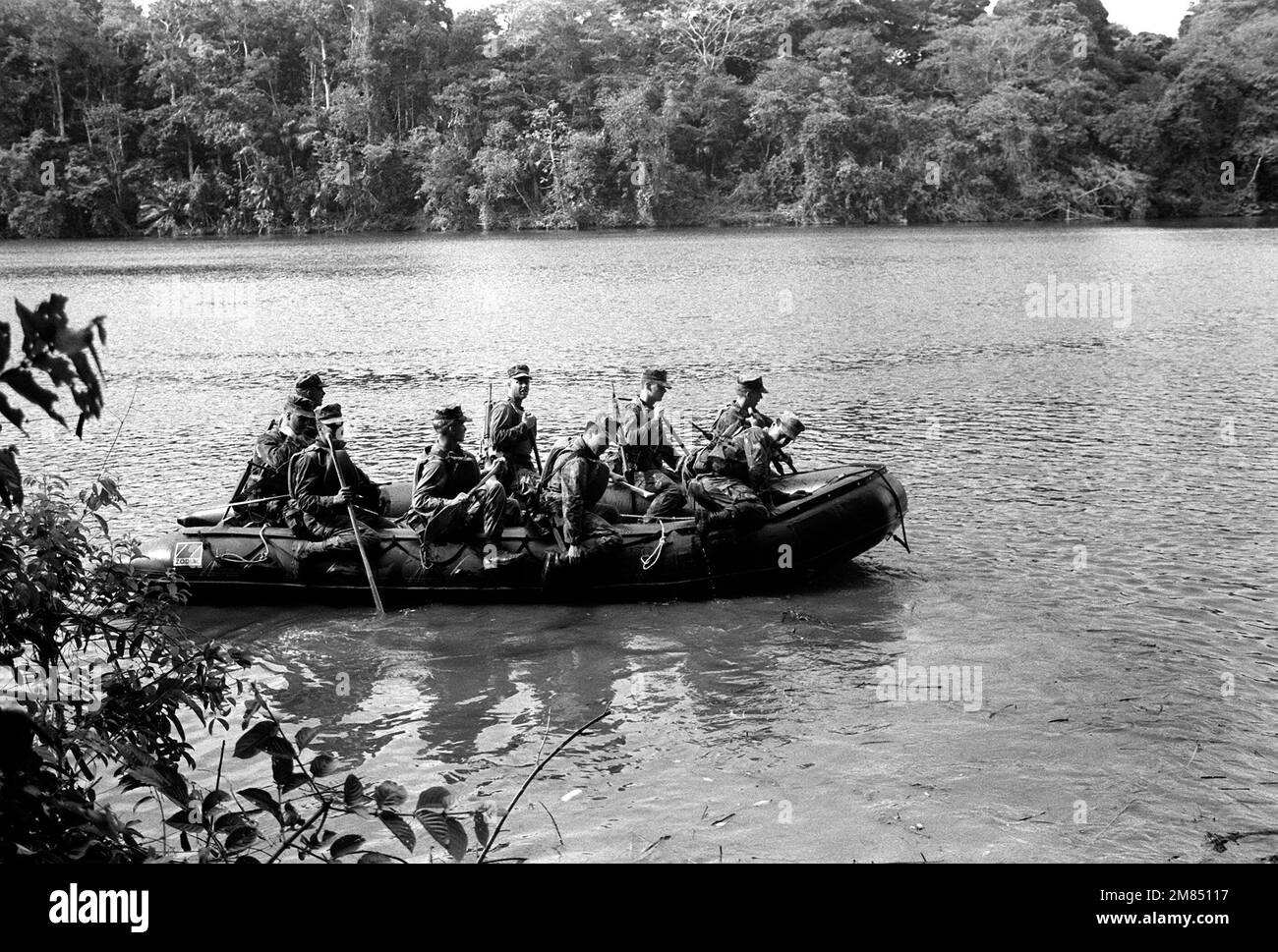 Members of the 1ST Battalion, 5th Marines, complete a raft race during ...