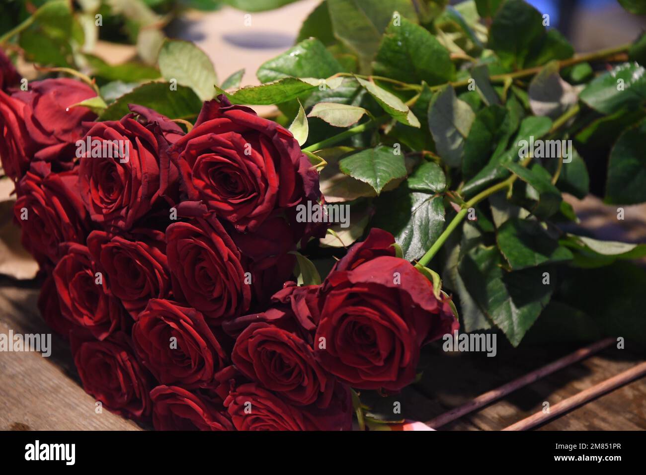 Copenhagen/Denmark/12 January 2023/ Red rose flowers making bouquest in ...