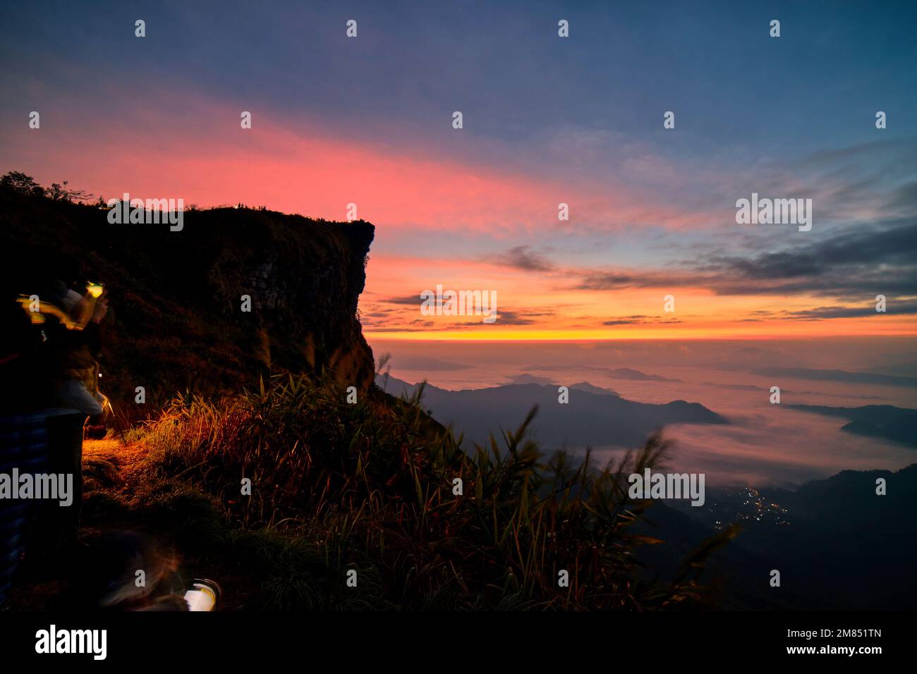 Dramatic sky with fog in early morning over the mountain at Phu Chee ...