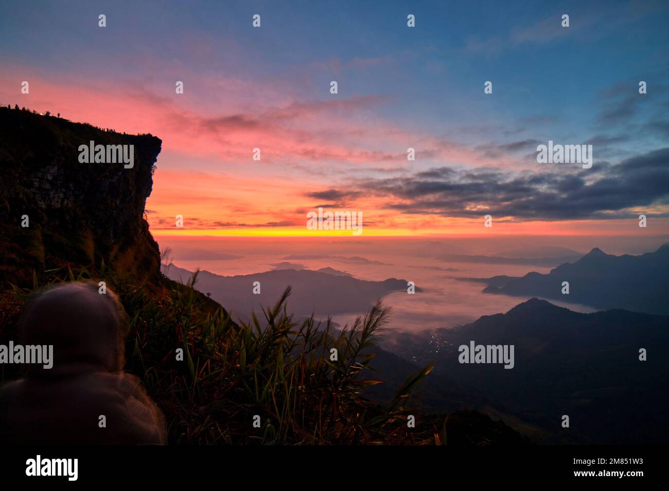 Dramatic sky with fog in early morning over the mountain at Phu Chee ...