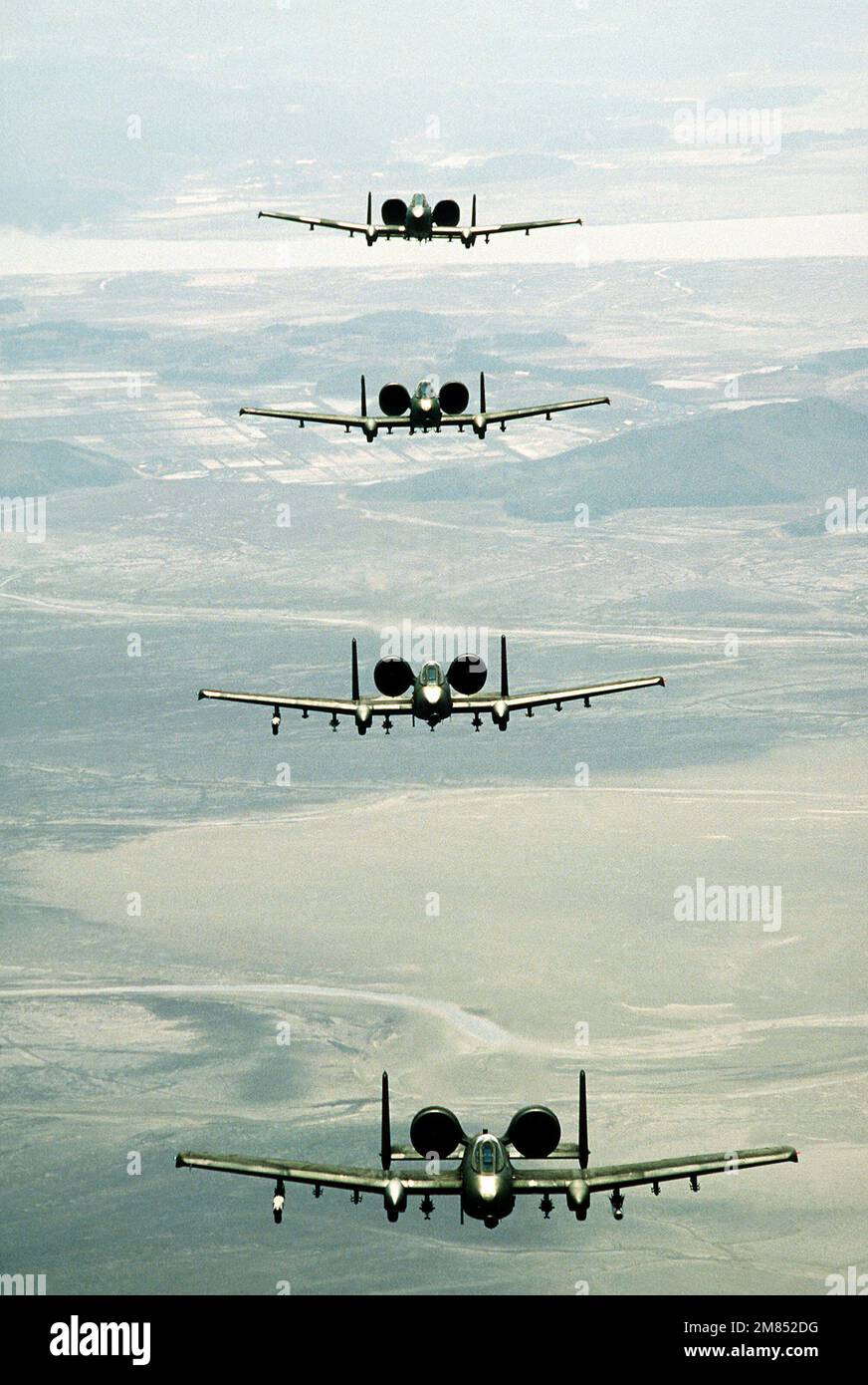 An air-to-air front view of four 25th Tactical Fighter Squadron A-10 ...