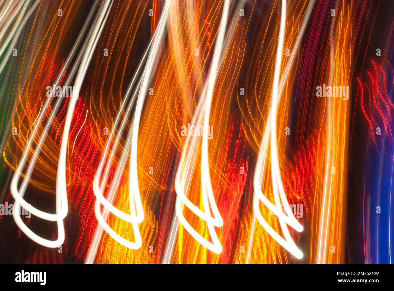 Looping colourful bright mostly orange and white long exposure light ...