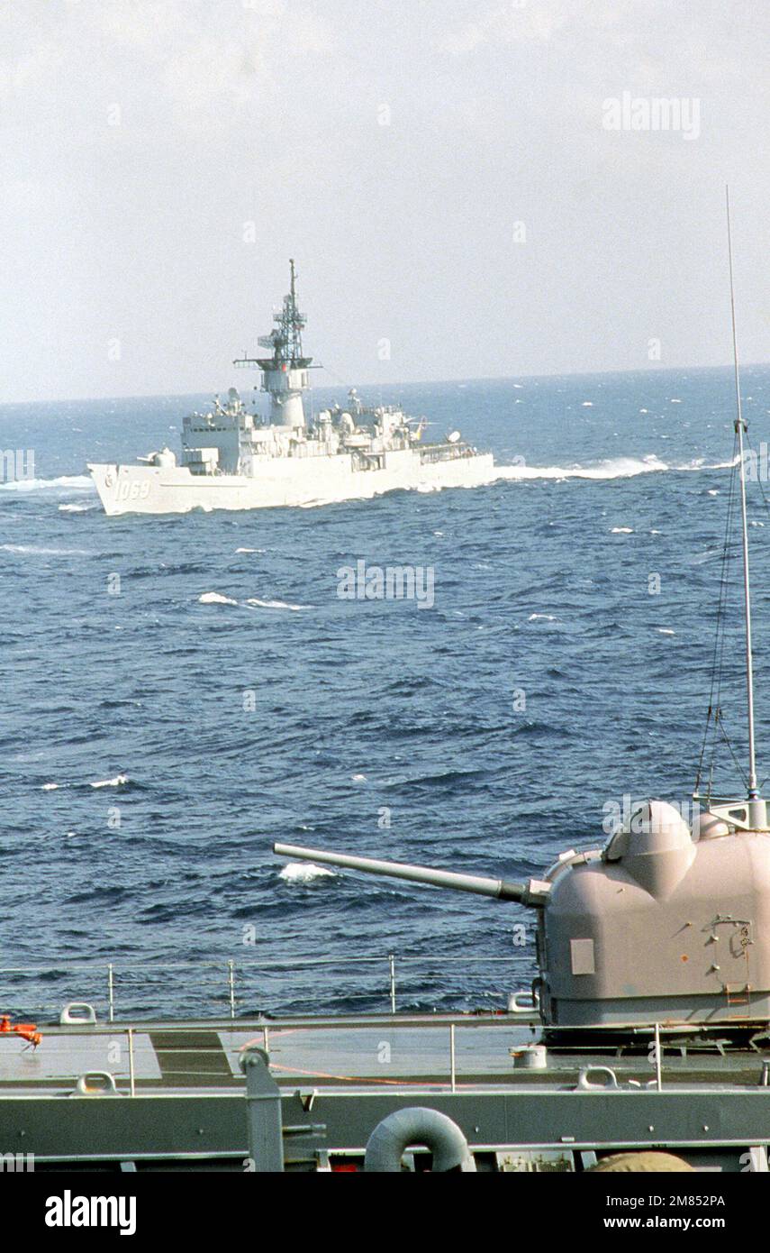 A port view of the frigate USS BAGLEY (FF-1069) underway. The Mark 42 5 ...
