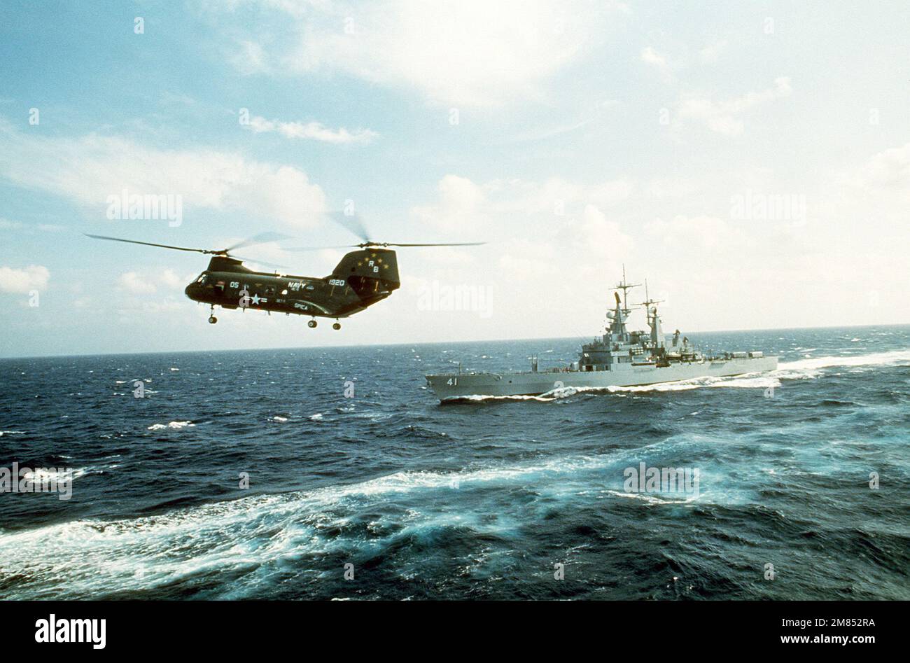 A port bow view of the nuclear-powered guided missile cruiser USS ...