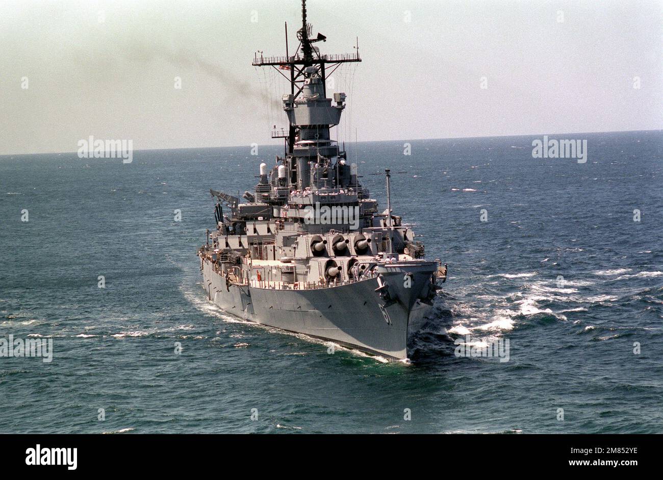 A starboard bow view of the battleship USS IOWA (BB-61) underway. Country: Pacific Ocean (POC ...