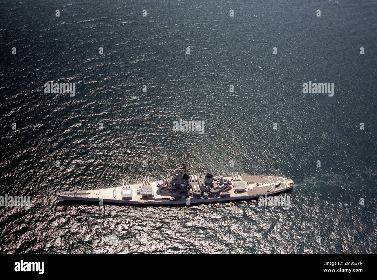 An overhead view of the three Mark 7 16-inch/50-caliber gun turrets of ...