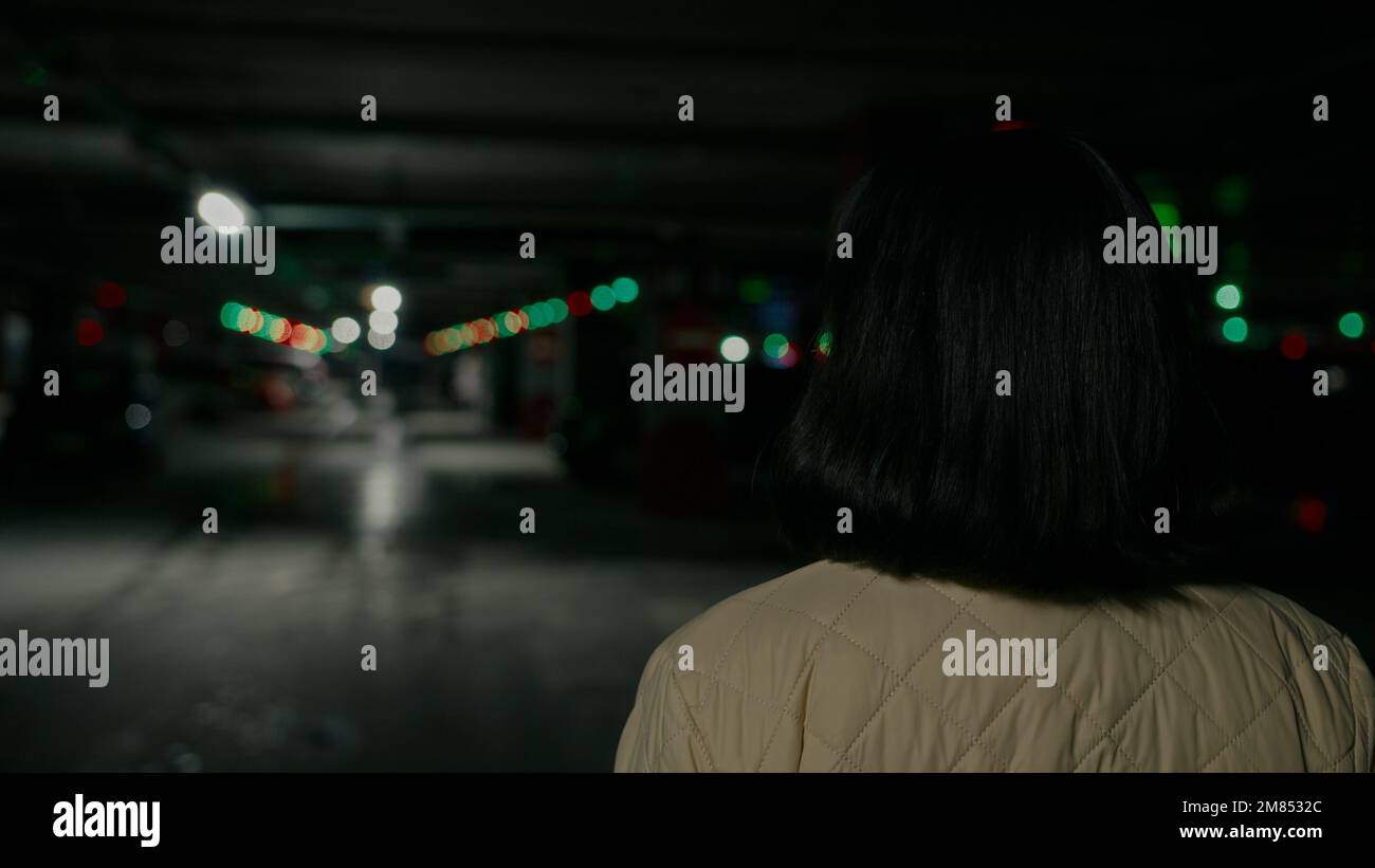 Back rear view from behind brunette with short hair woman walk at ...