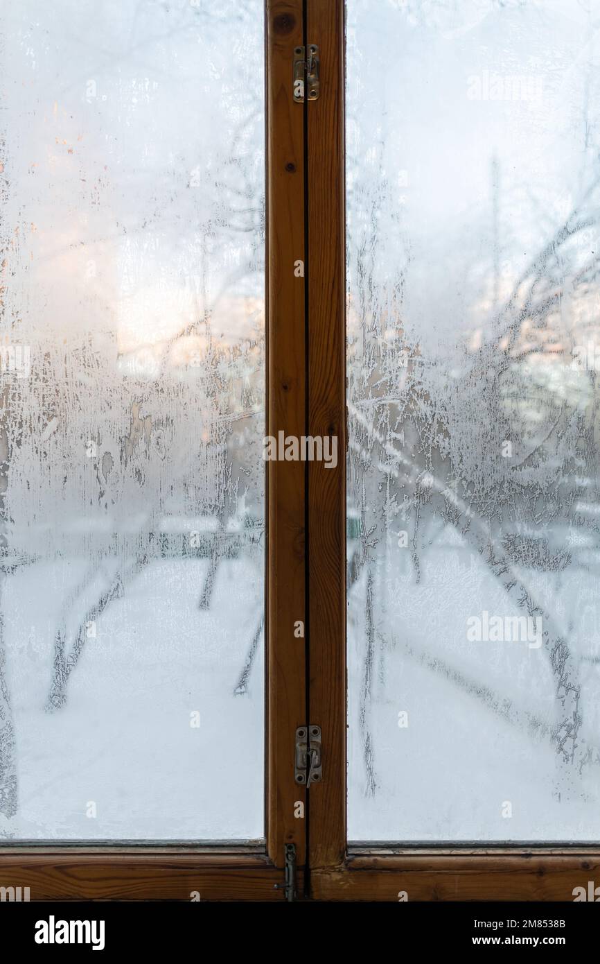 window with traces of frost on the glass. frosted glass. window in ...