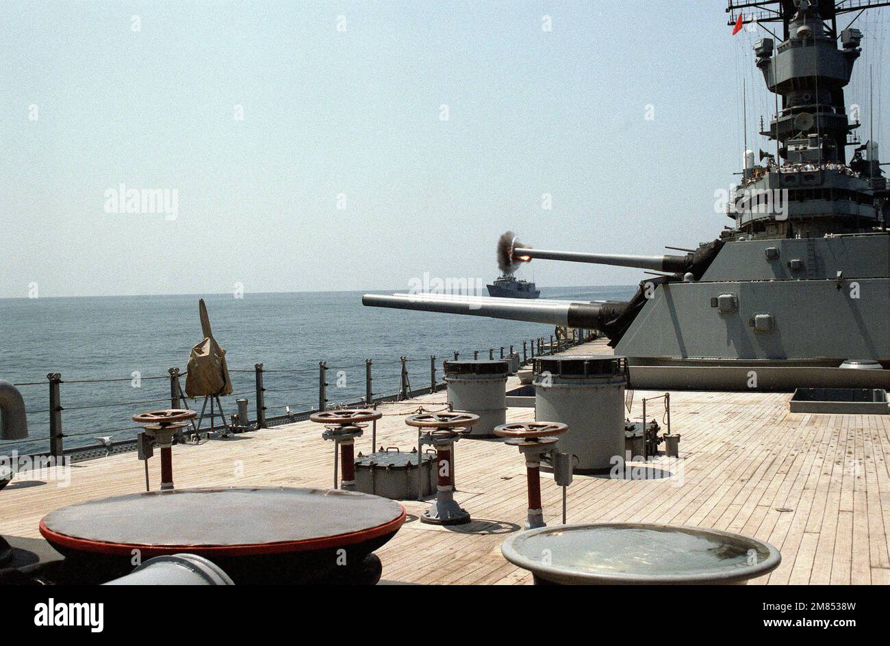 A round is fired from the No. 2 Mark 7 16-inch/50-caliber gun turret of ...