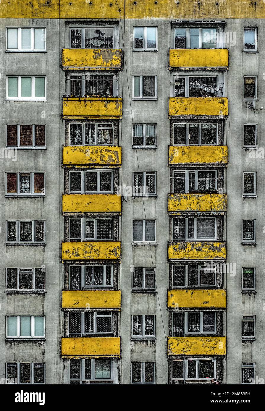 Former soviet built concrete housing with peeling yellow paint in Lodz ...