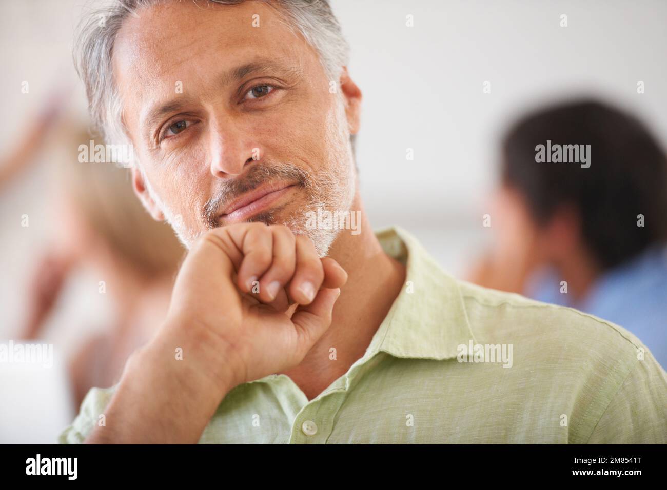 His business accumen is invaluable. Handsome mature businessman looking ...