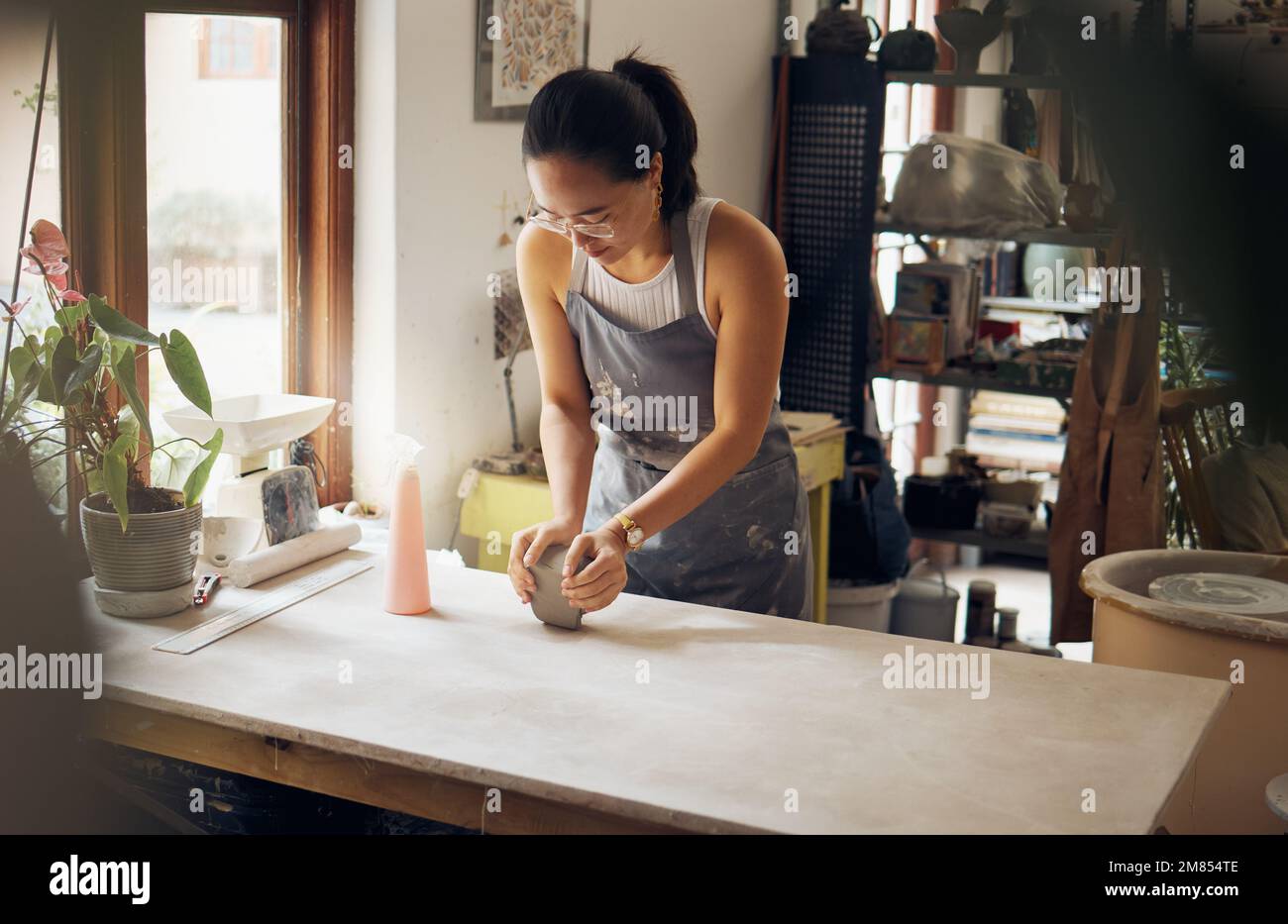 Creative, small business and pottery girl working with clay for idea ...