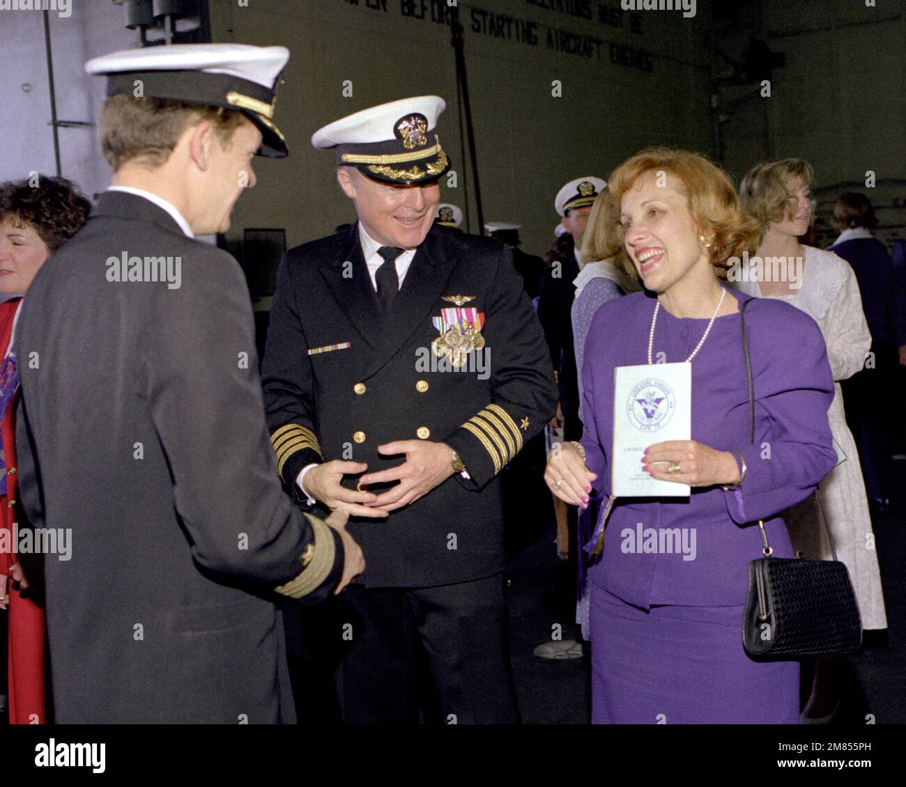 Guests greets CAPT. George D. O'Brien Jr., the new commanding officer ...