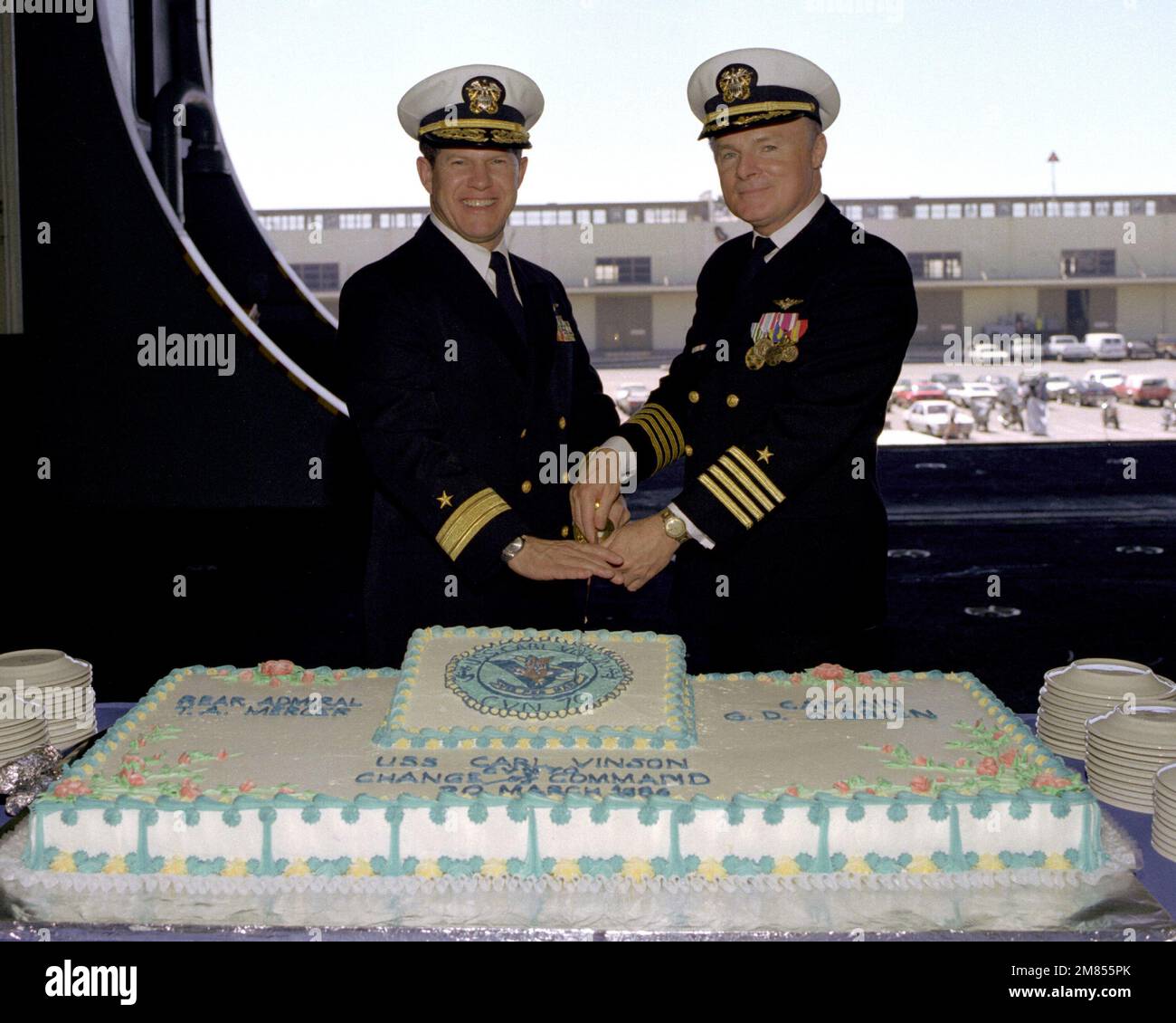 Rear Adm. (lower half) Thomas A. Mercer, left, and CAPT. George D. O ...
