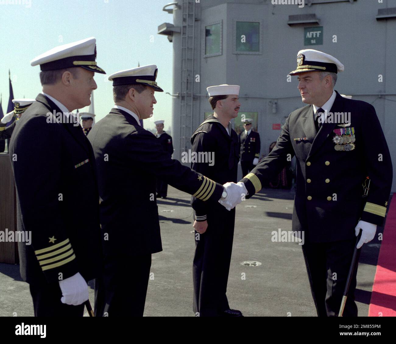 Rear Adm. (lower half) Edward W. Clexton Jr. commander, Carrier Group ...