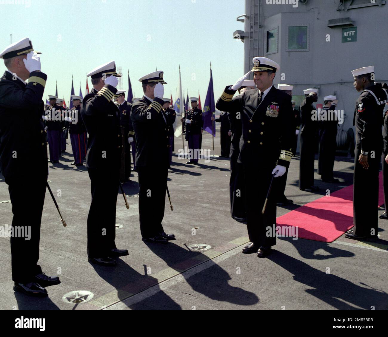 Exchanging salutes with Vice Adm. James E. Service, commander, Naval ...