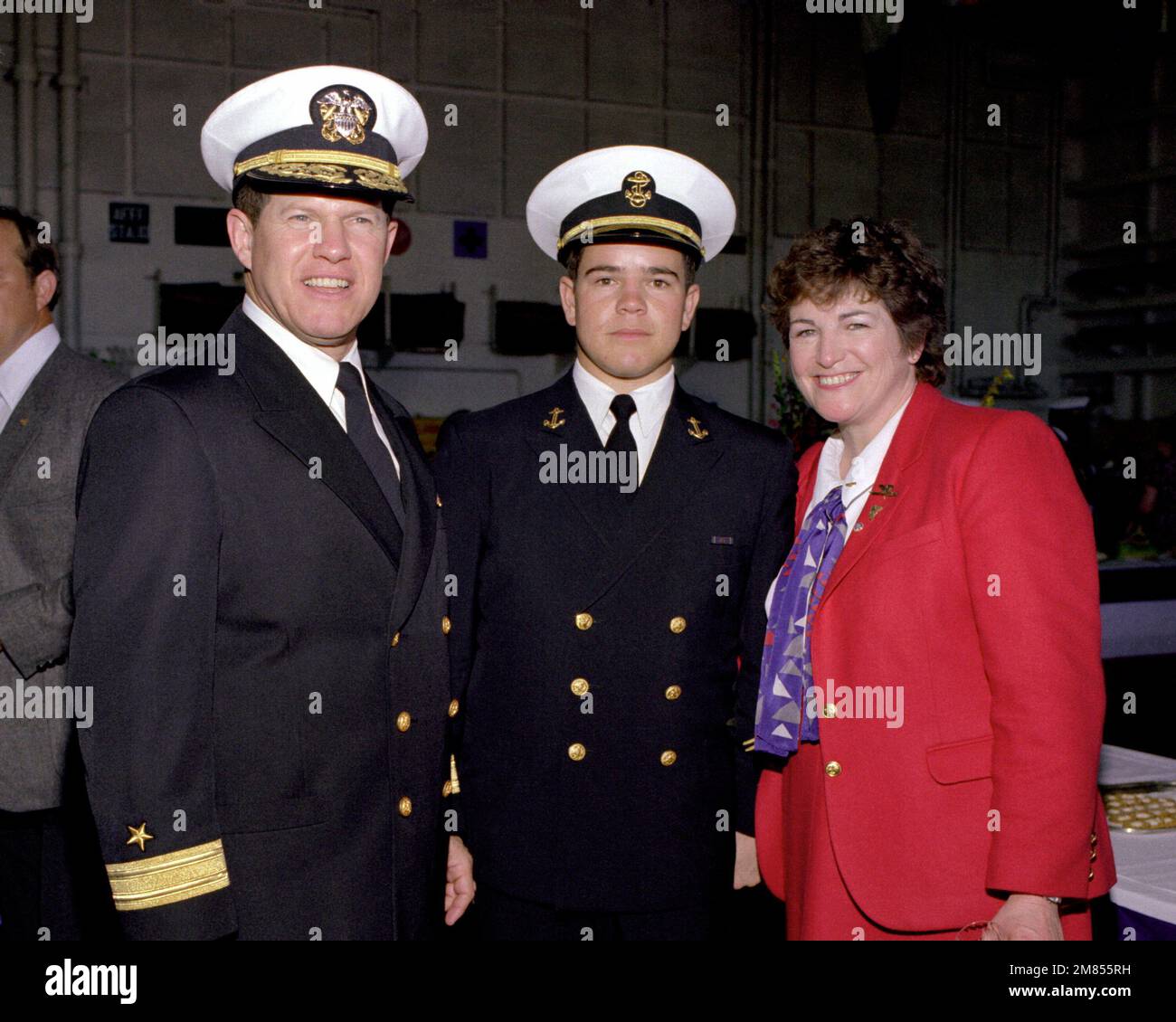 Rear Adm. (lower half) Thomas A. Mercer poses for photo with his family ...