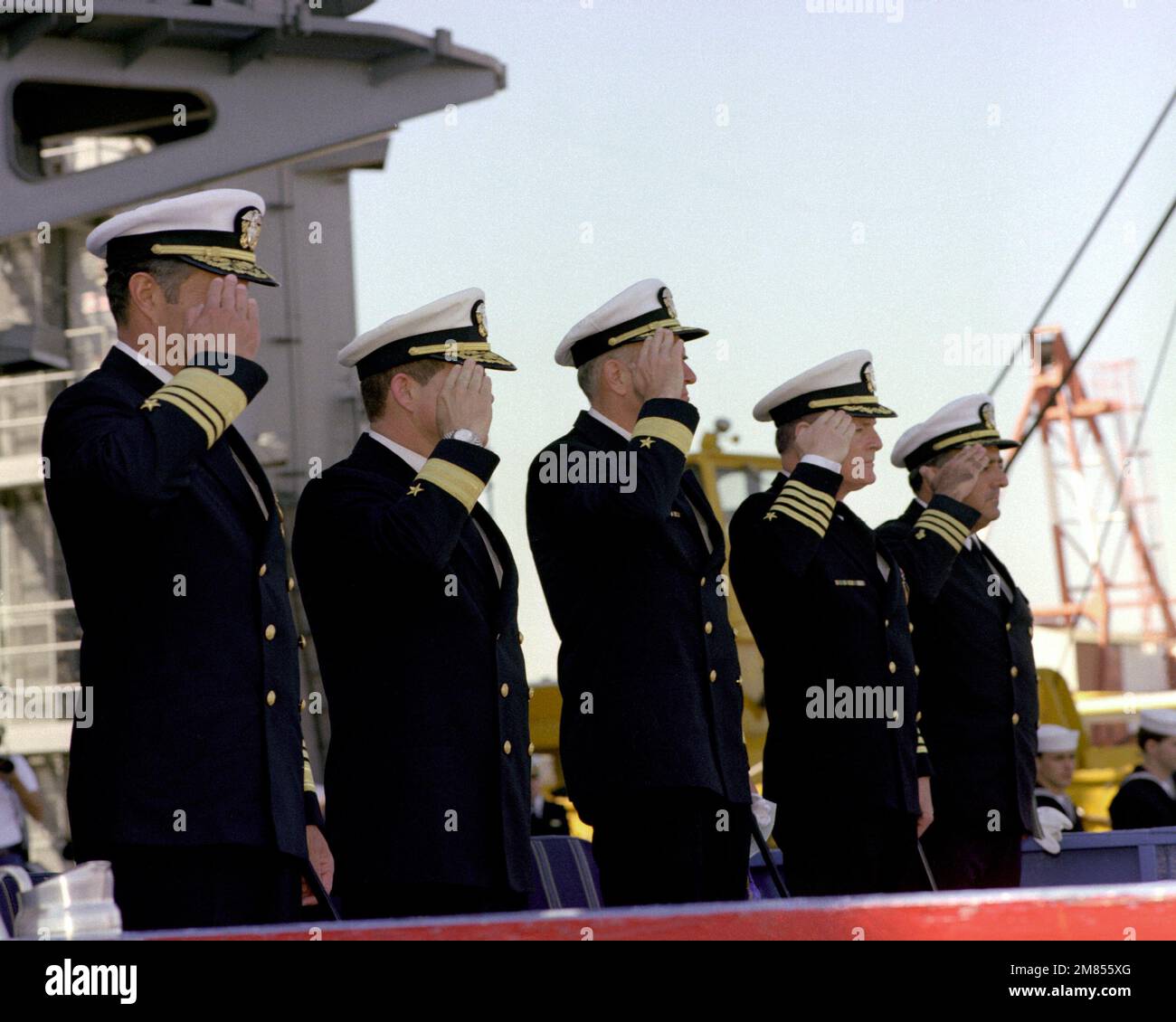 Saluting during the change of command ceremony aboard the nuclear ...