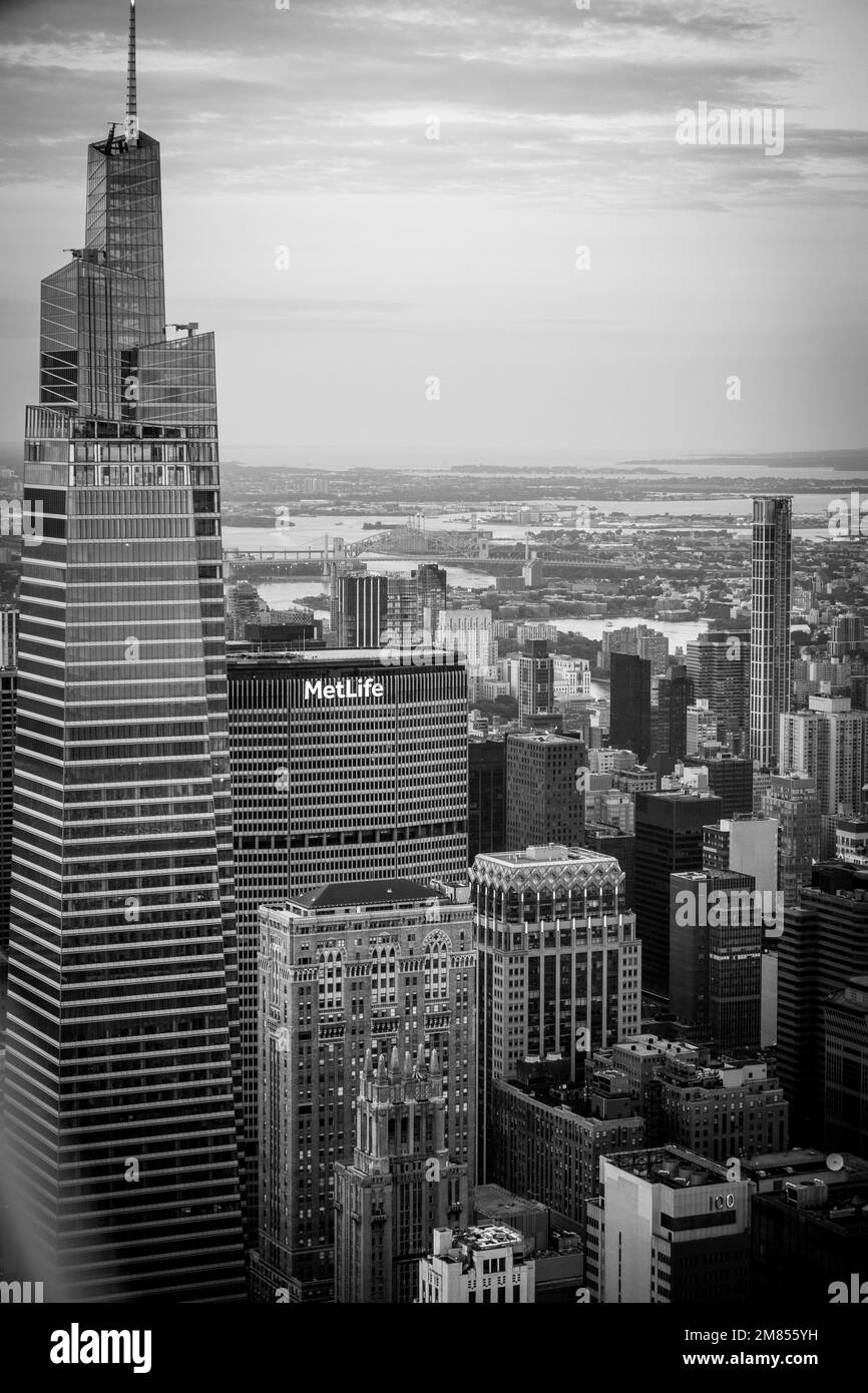A vertical greyscale of the Empire State Building in New York City ...