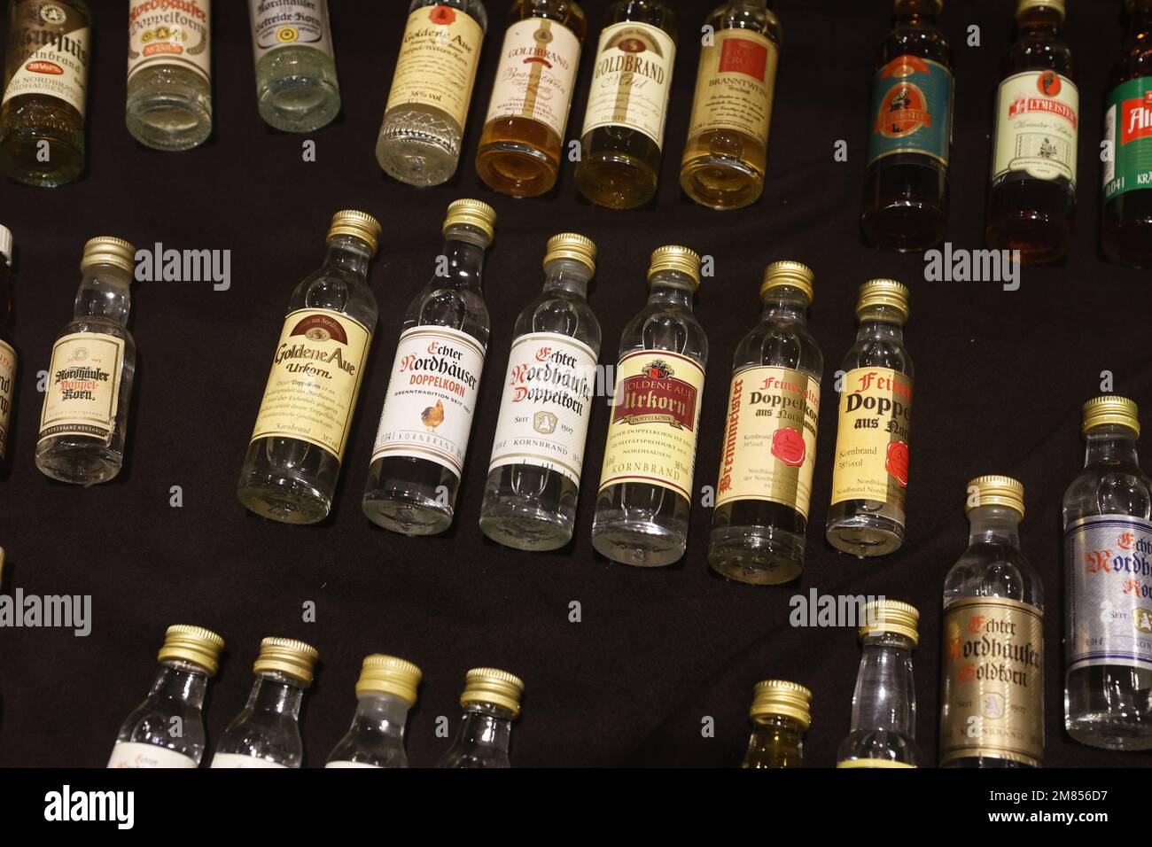 Nordhausen, Germany. 12th Jan, 2023. Miniature bottles lie in a glass ...
