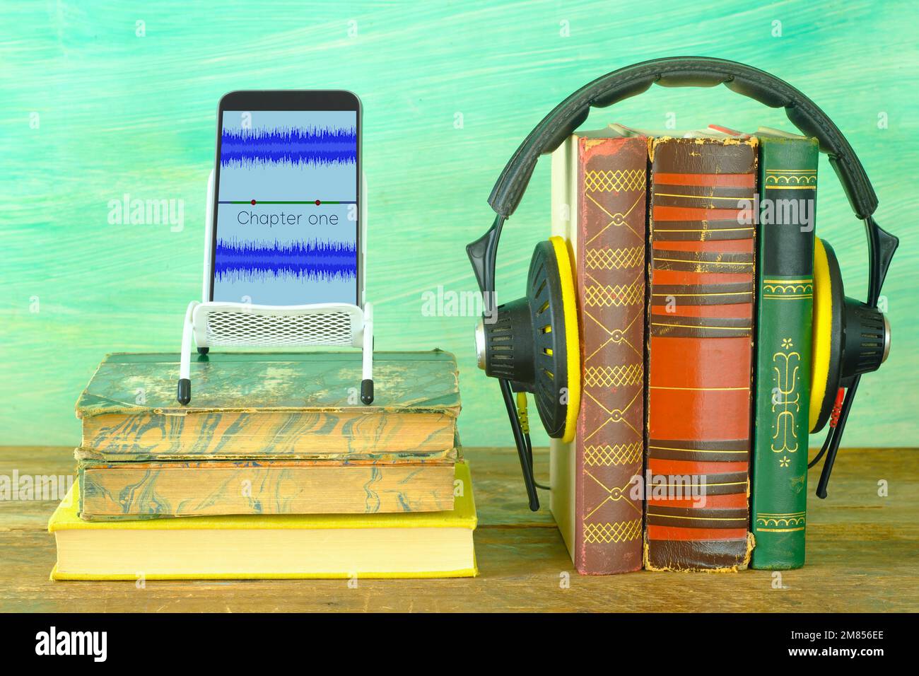audio book concept with books and vintage headphone and smartphone on ...