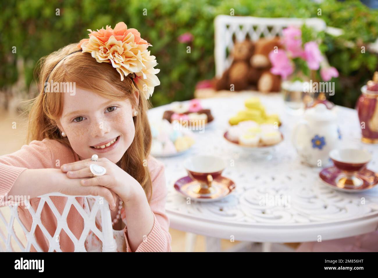 Tea-time with my Teddy. A little girl sitting outside having a tea ...