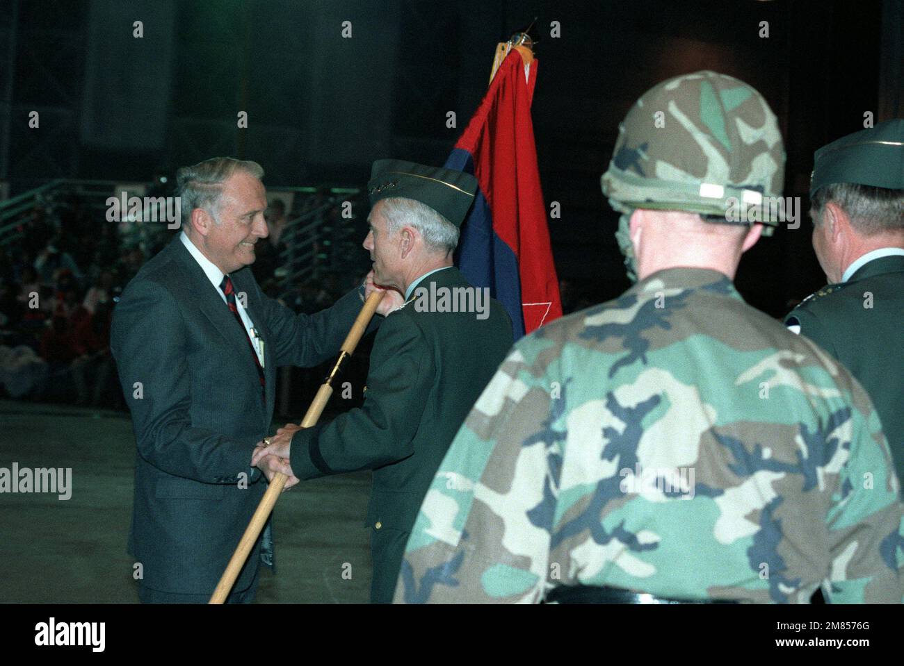 Secretary of the Army John O. Marsh passes the command flag to GEN John ...