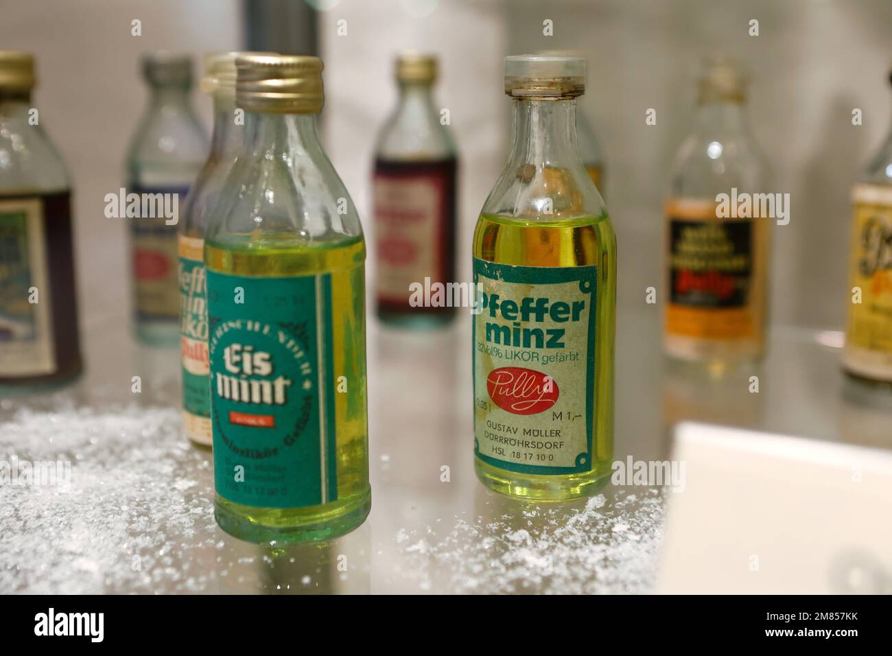 Nordhausen, Germany. 12th Jan, 2023. Miniature bottles lie in a glass ...