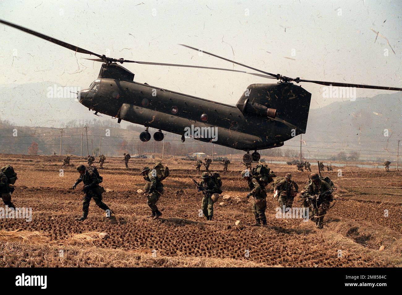 Soldiers of the 1ST Bn., 35th Inf., 25th Inf. Div., move out of the air ...