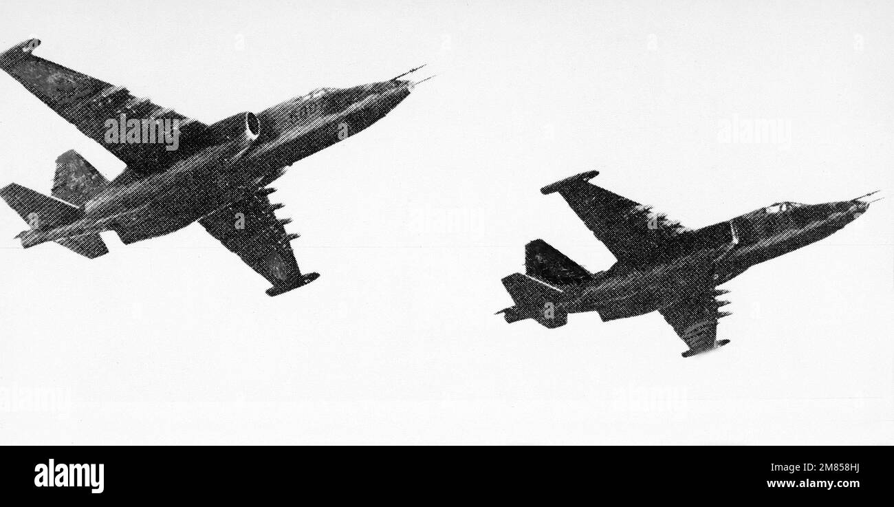Two Soviet Su-25 Frogfoot ground attack aircraft in flight. Country ...