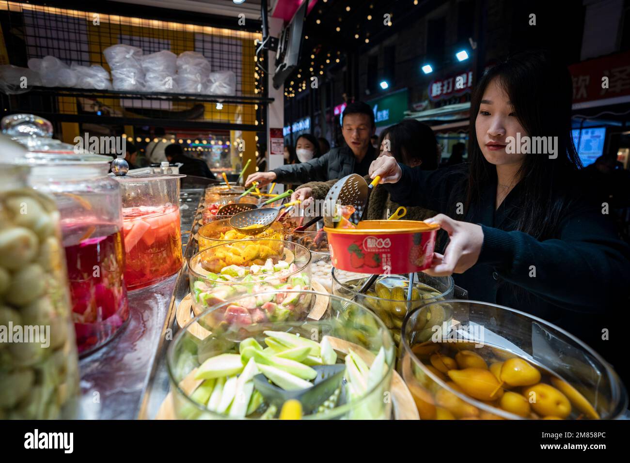 Kunming, China's Yunnan Province. 11th Jan, 2023. Residents select ...