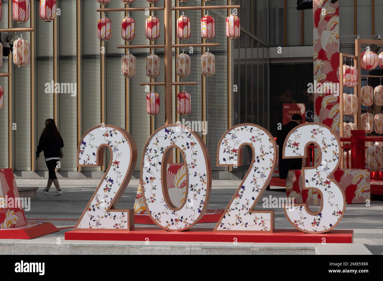 SHANGHAI, CHINA - JANUARY 12, 2023 - Pedestrians walk past the LOGO of ...