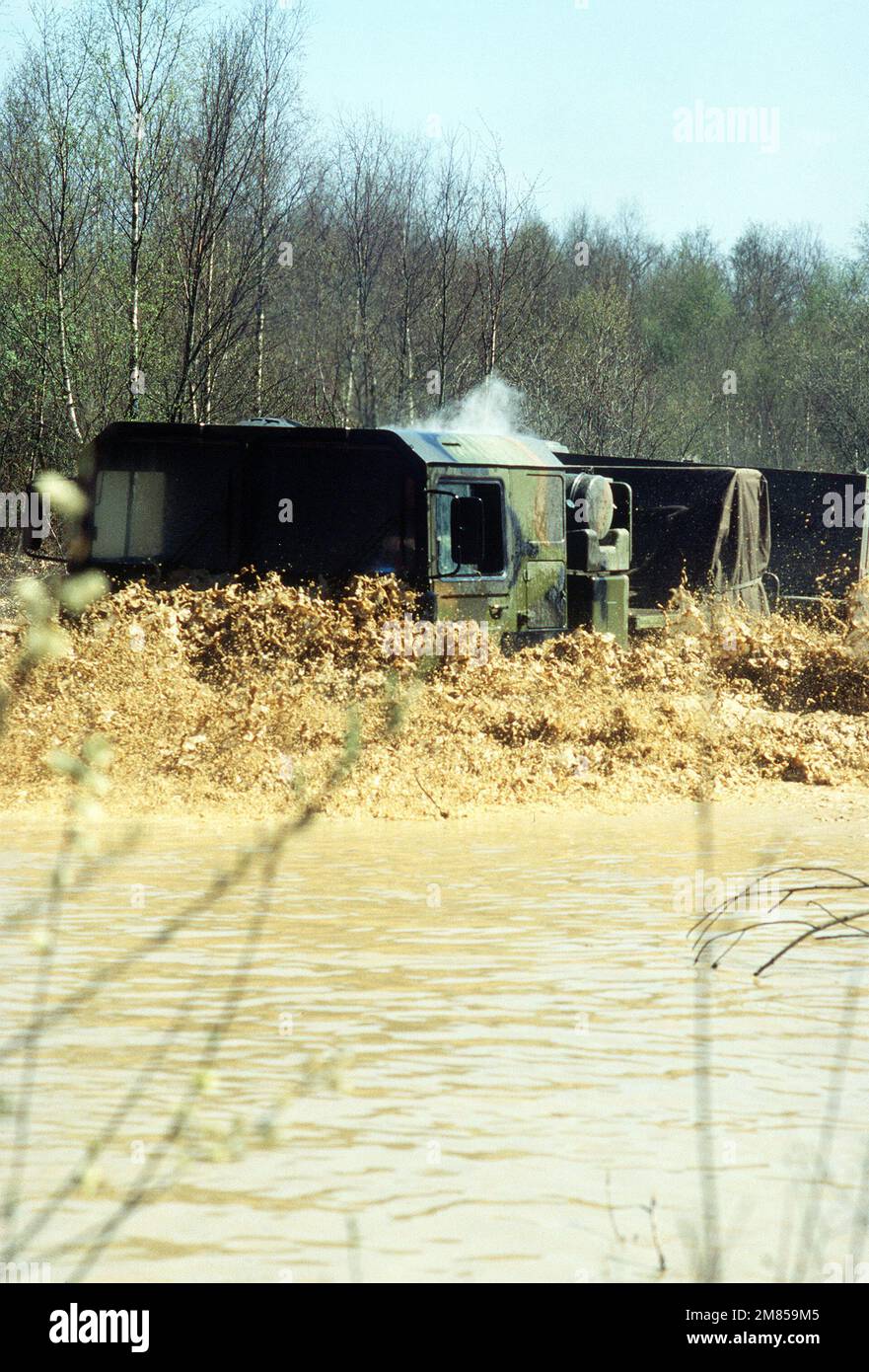 A ground-launched cruise missile transporter-erector-launcher is driven ...