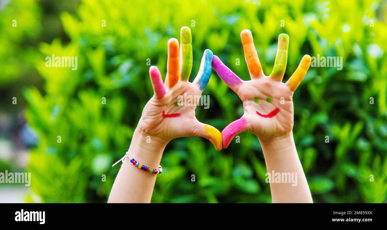 Children's hands in the colors of summer. Selective focus.arts Stock ...
