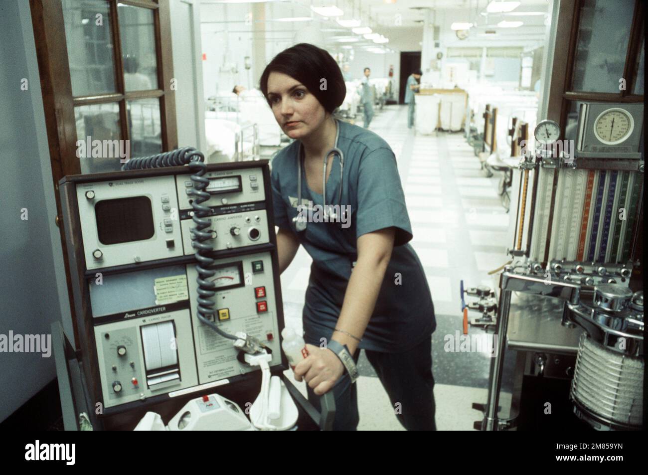 A U.S. Army nurse pushes a defibrillator cart. Country: Unknown Stock ...