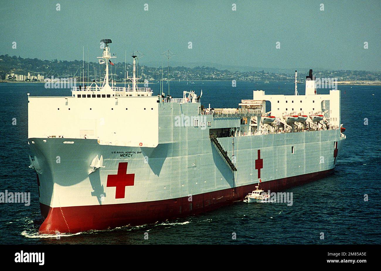 A port bow view of the hospital ship USNS MERCY (T-AH-19) underway ...