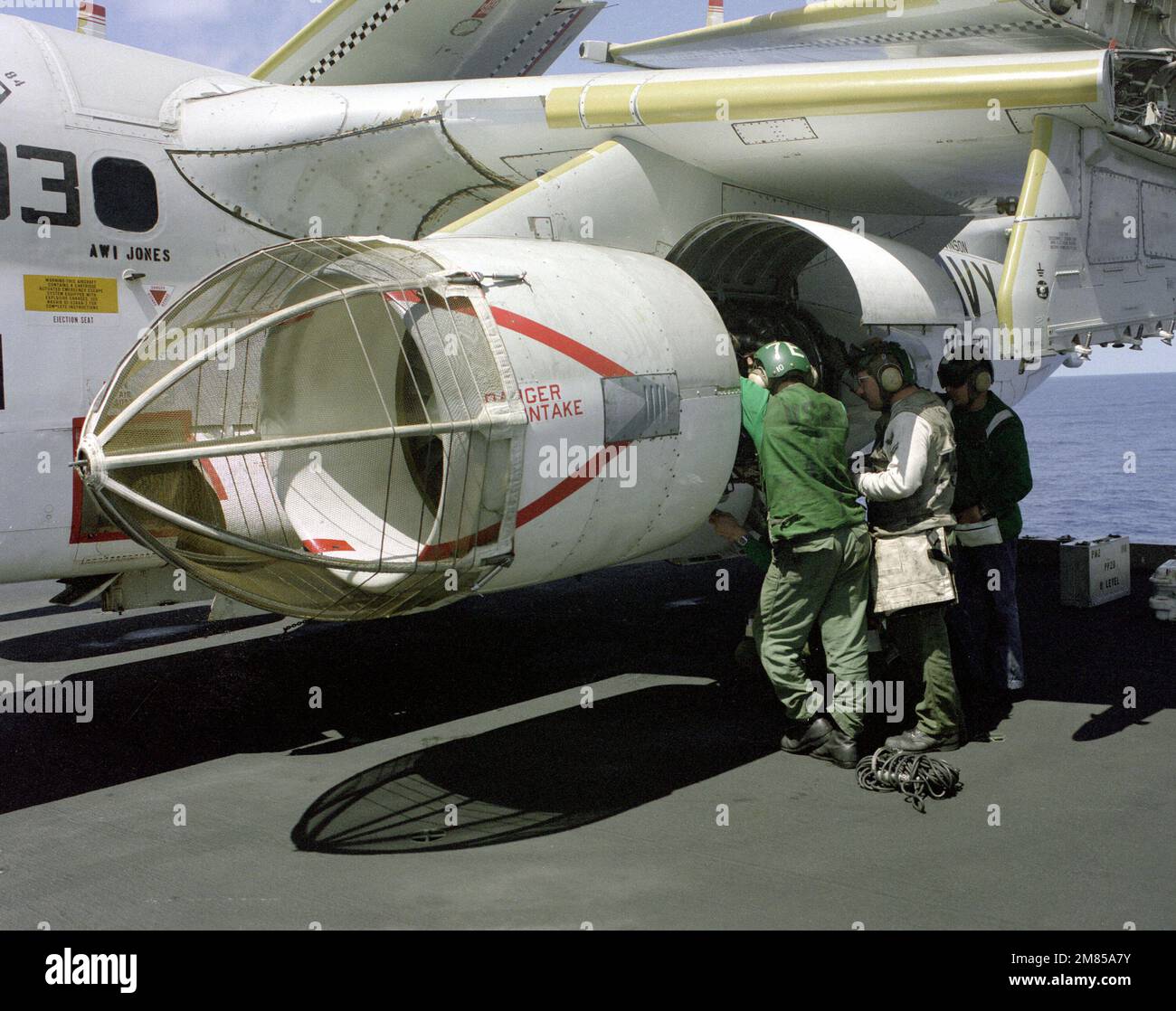 Aviation machinist's mates inspect the port engine of an S-3A Viking ...