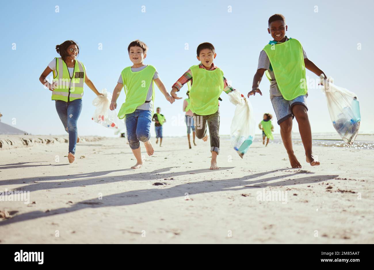 Happy kids team recycling hi-res stock photography and images - Alamy